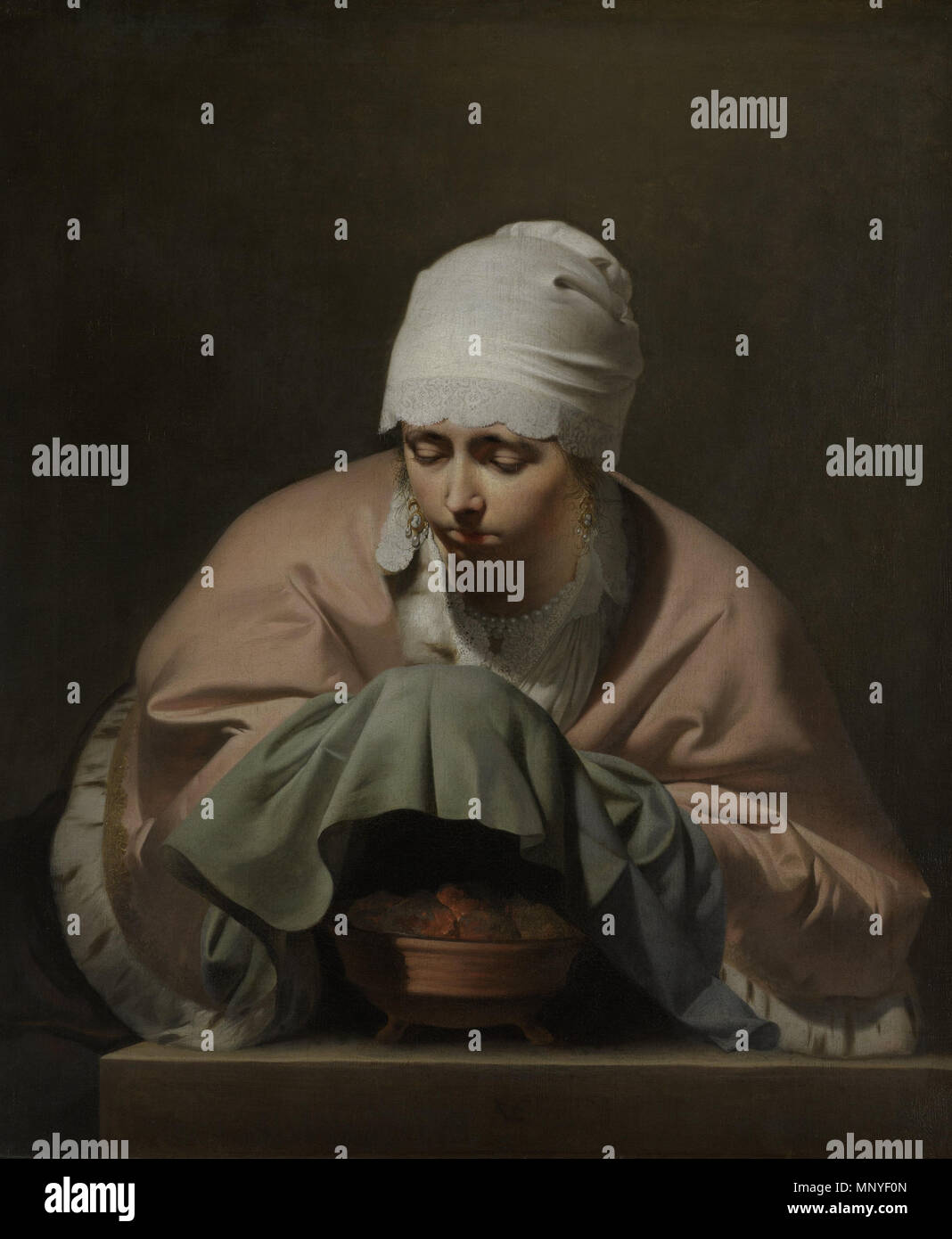 Young woman warming her hands over a brazier hi-res stock photography ...