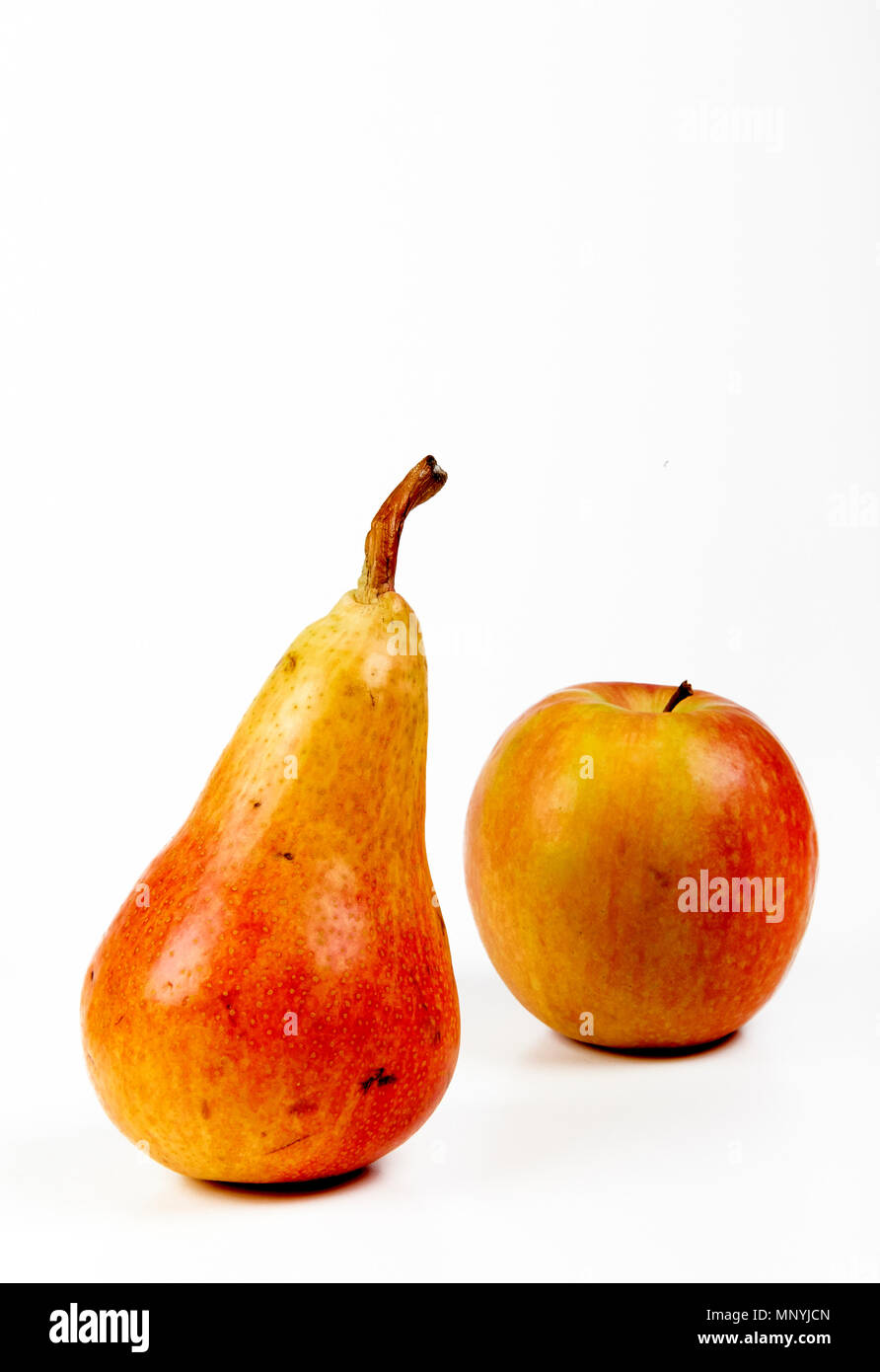 a pear and an apple on white background Stock Photo - Alamy