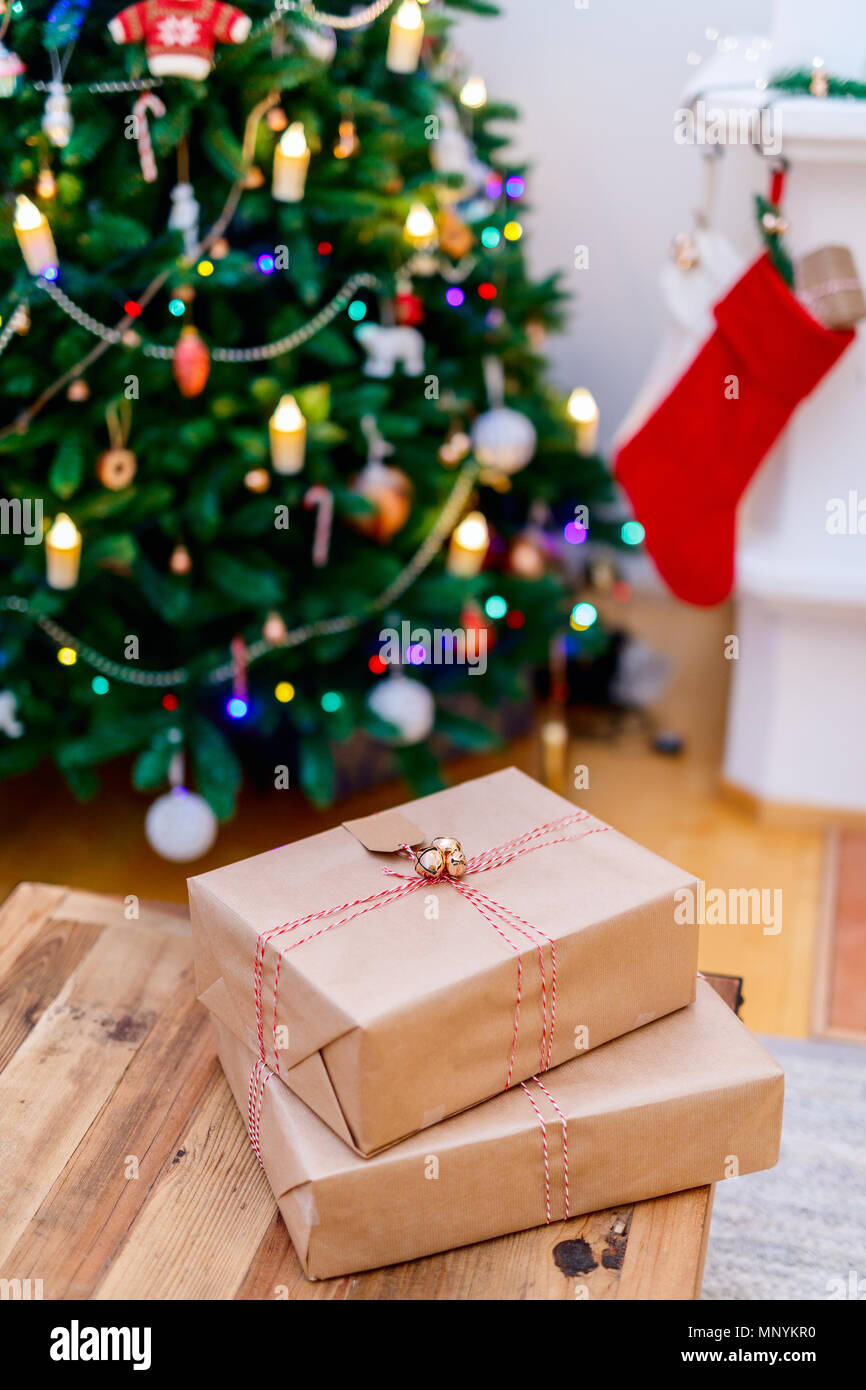 Christmas presents in a beautifully decorated room with fireplace, tree ...