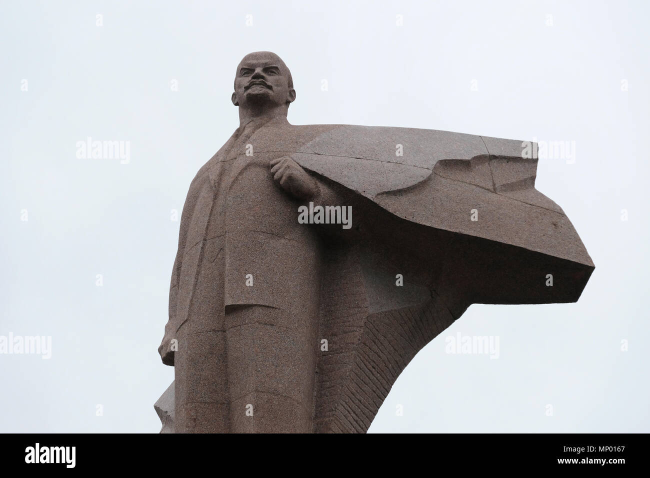 Soviet-era statue of Vladimir Lenin in front of the parliament building ...