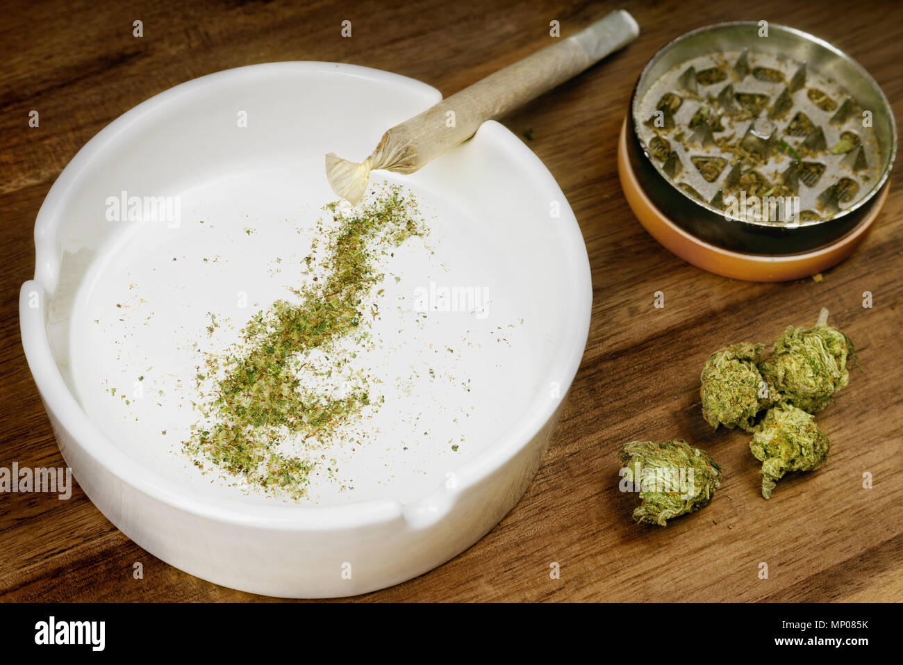 Crumbled weed in the shape of Monaco and a joint. (series Stock Photo ...