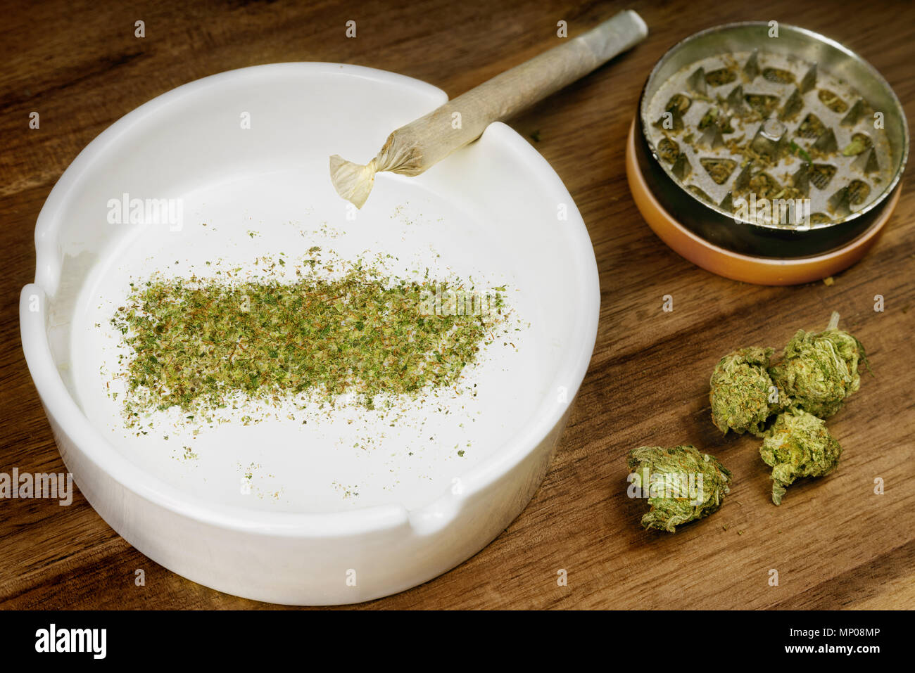 Crumbled weed in the shape of Puerto Rico and a joint. (series Stock ...