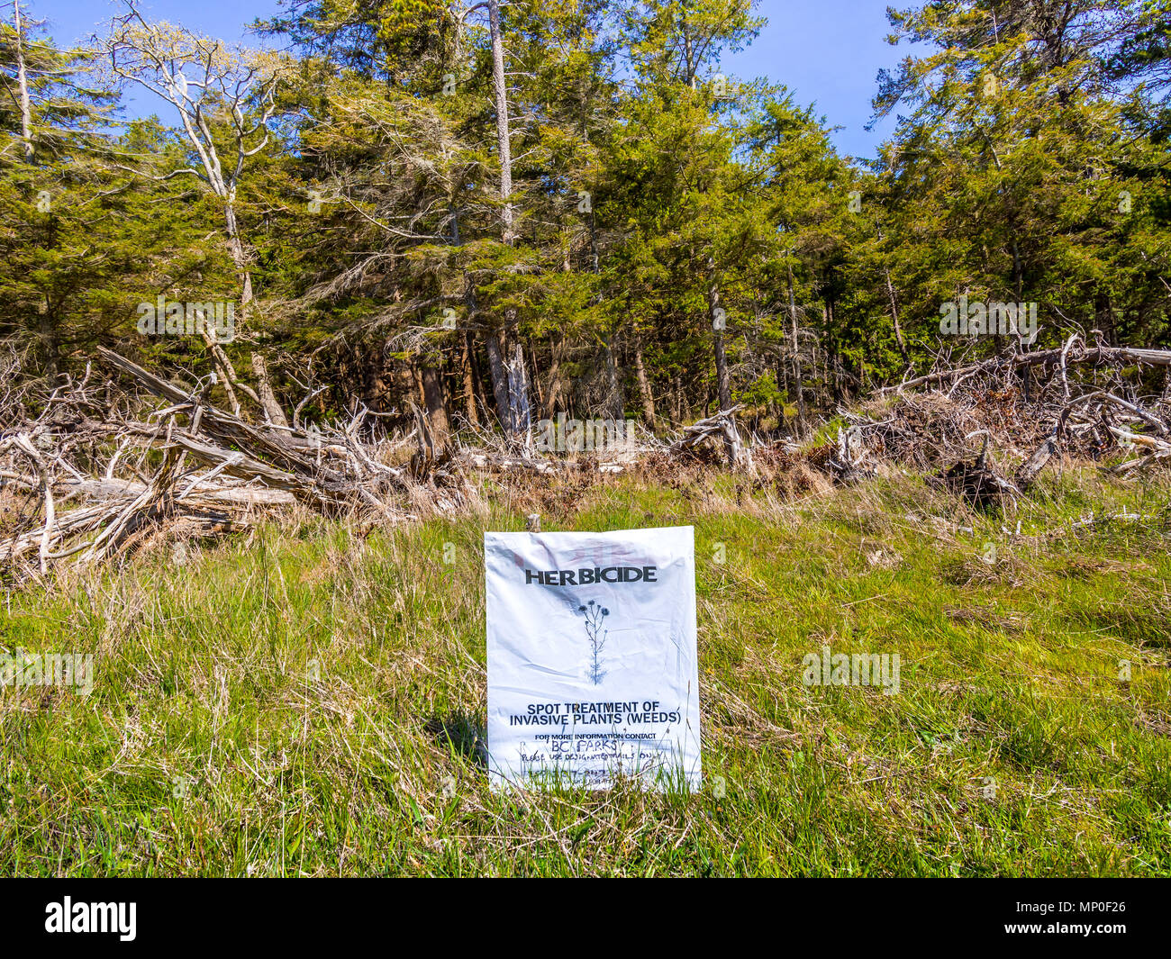 Herbicide warning notice on sprayed weeds, Helliwell Provincial Park ...
