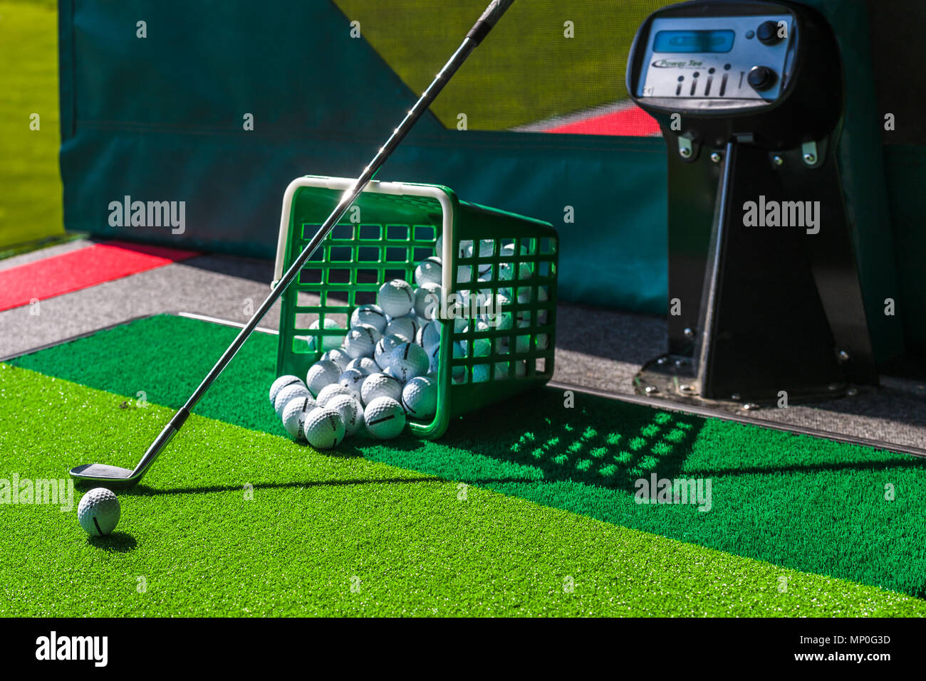 Golf balls, basket of balls & Golf clubs at driving range images Stock ...