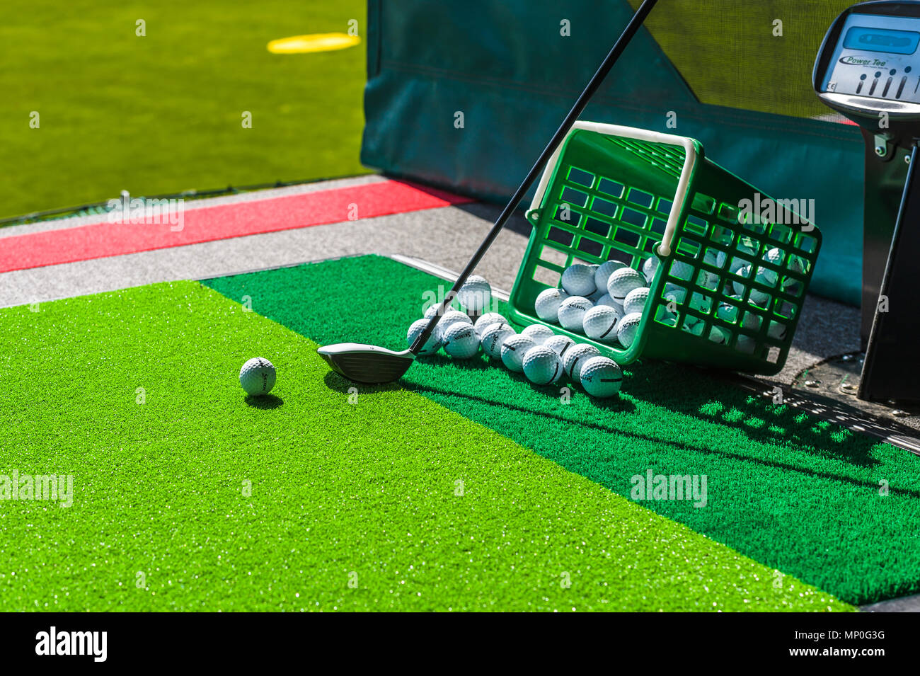 Golf balls, basket of balls & Golf clubs at driving range images Stock ...