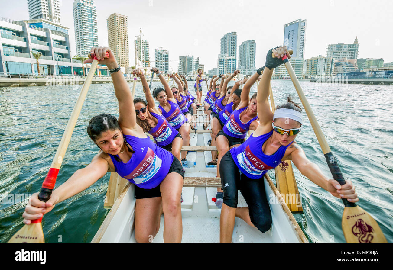 Woman rowing team Dubai Marina Stock Photo - Alamy