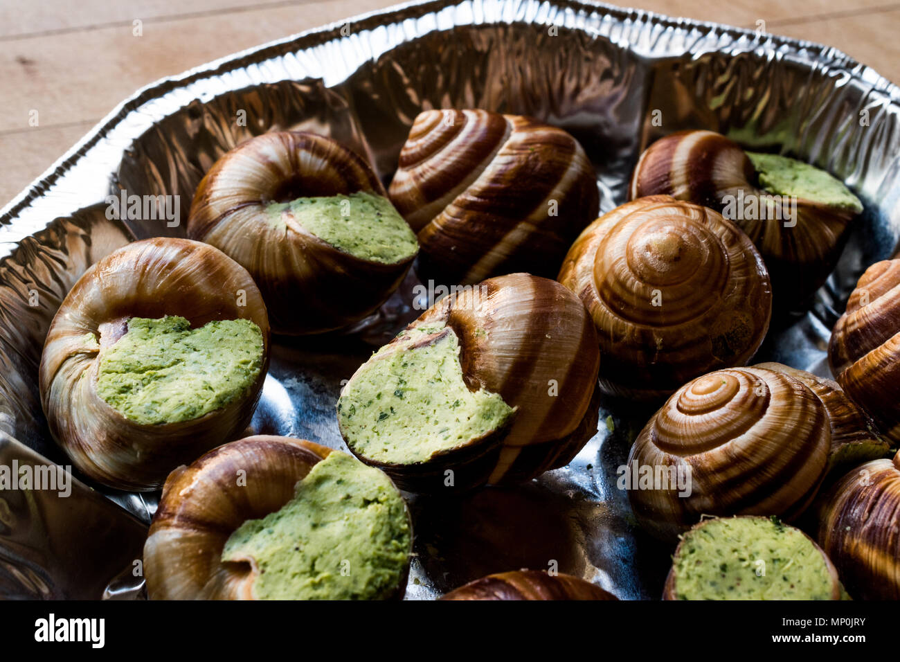 Frozen Snail food with Garlic Butter. Organic Food Stock Photo - Alamy