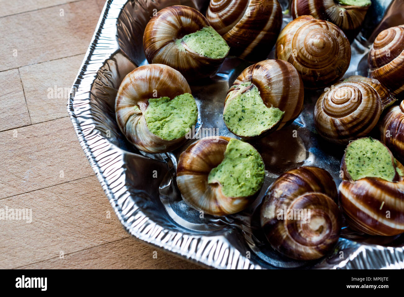 Frozen Snail food with Garlic Butter. Organic Food Stock Photo - Alamy