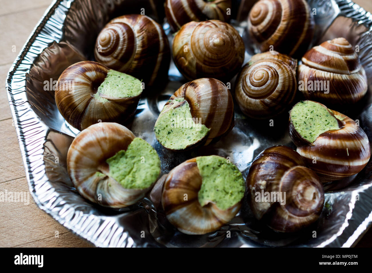 Frozen Snail food with Garlic Butter. Organic Food Stock Photo - Alamy