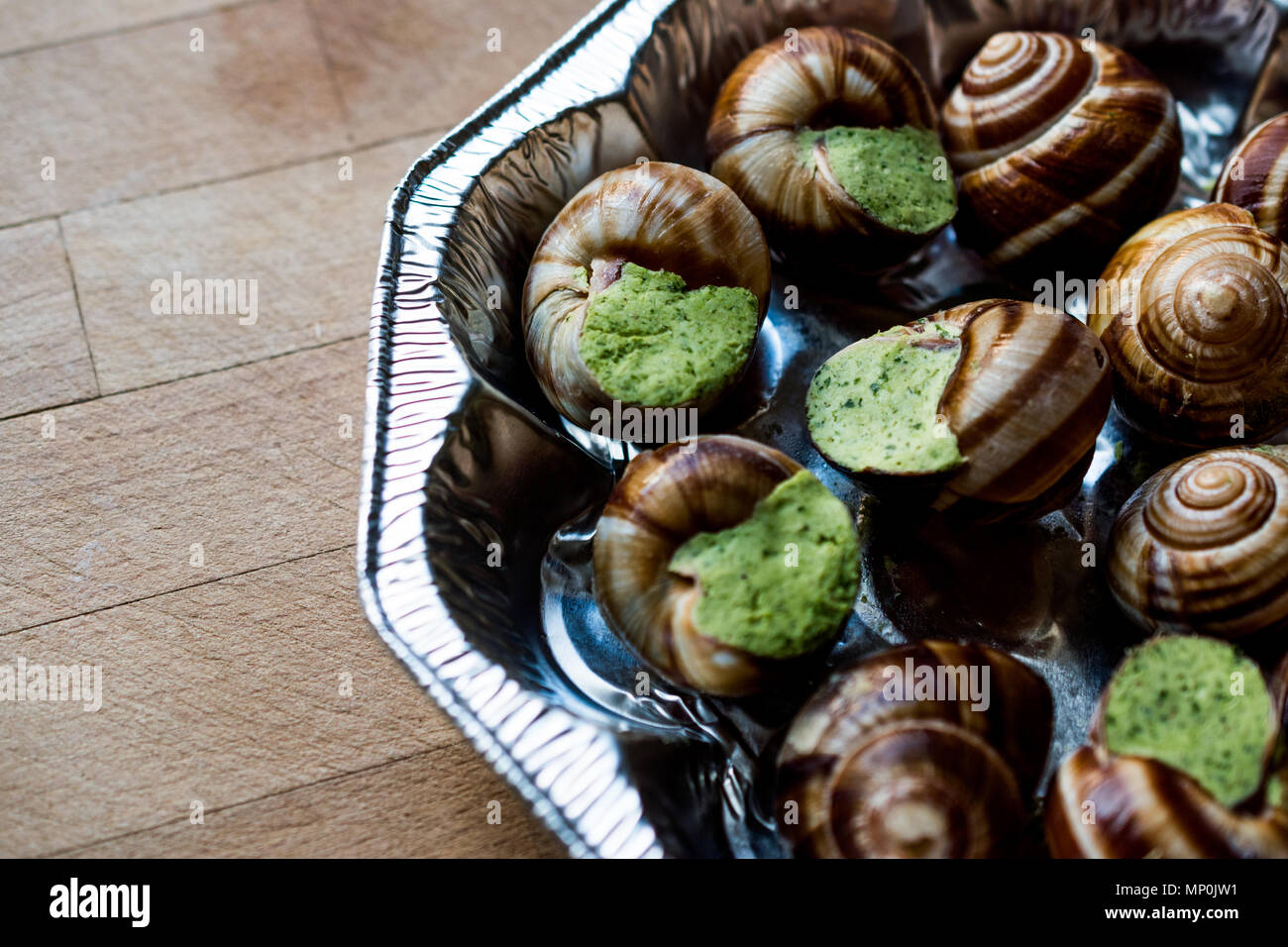 Frozen Snail food with Garlic Butter. Organic Food Stock Photo - Alamy