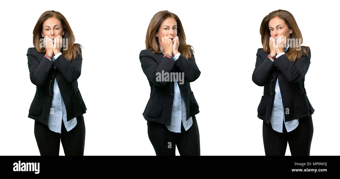 Middle age business woman terrified and nervous expressing anxiety and ...