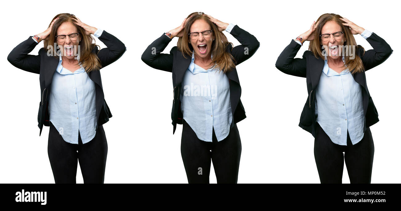 Middle age business woman stressful keeping hands on head, terrified in ...