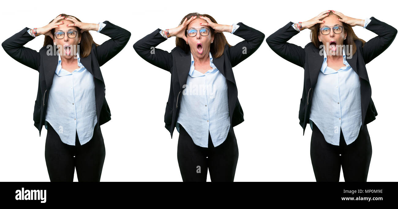 Middle age business woman stressful keeping hands on head, terrified in ...