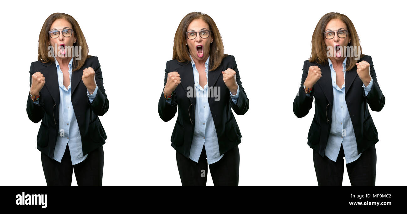 Middle age business woman happy and excited celebrating victory ...