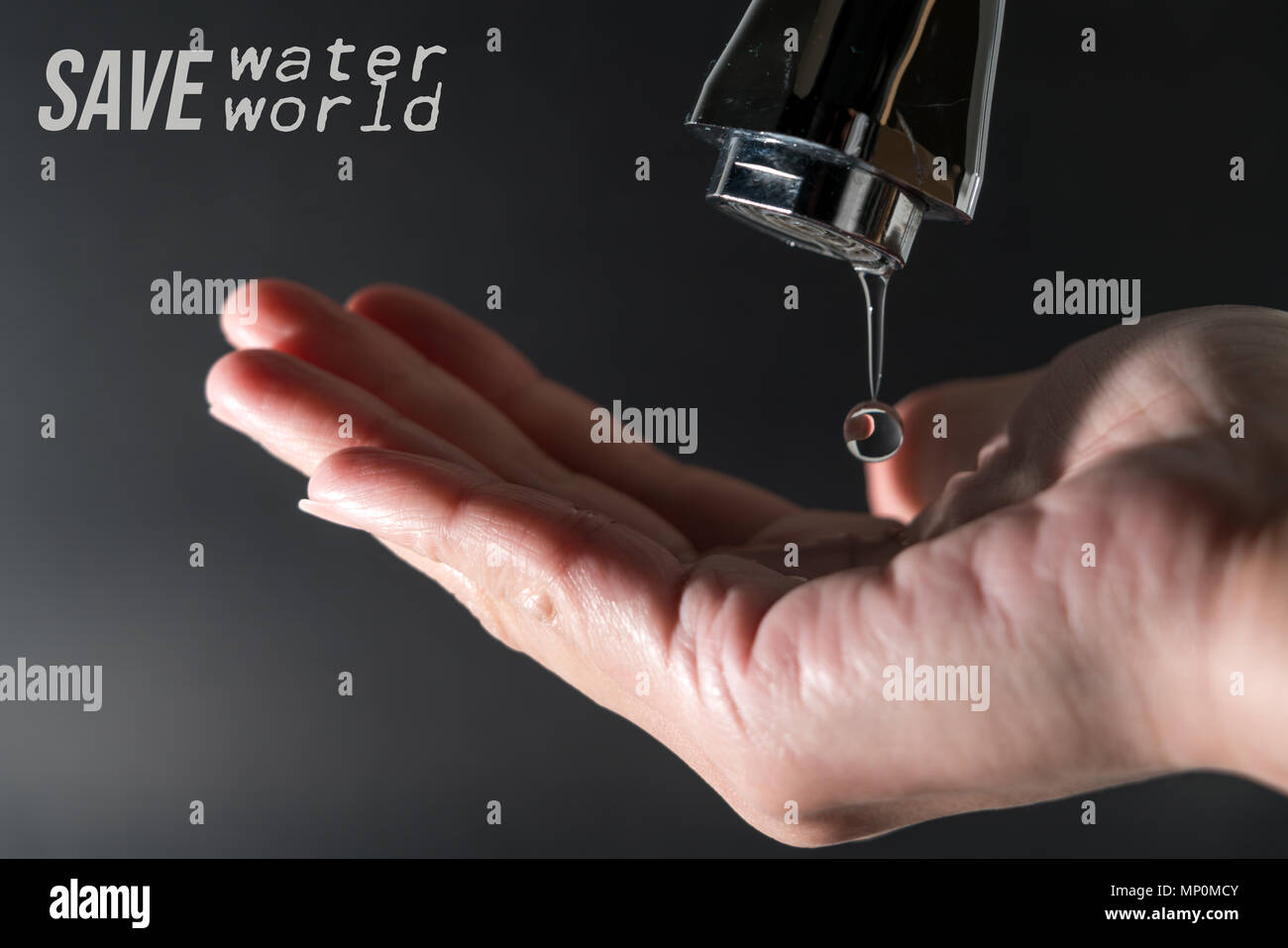 water drop on faucet with black backgrounds, world water day concept ...