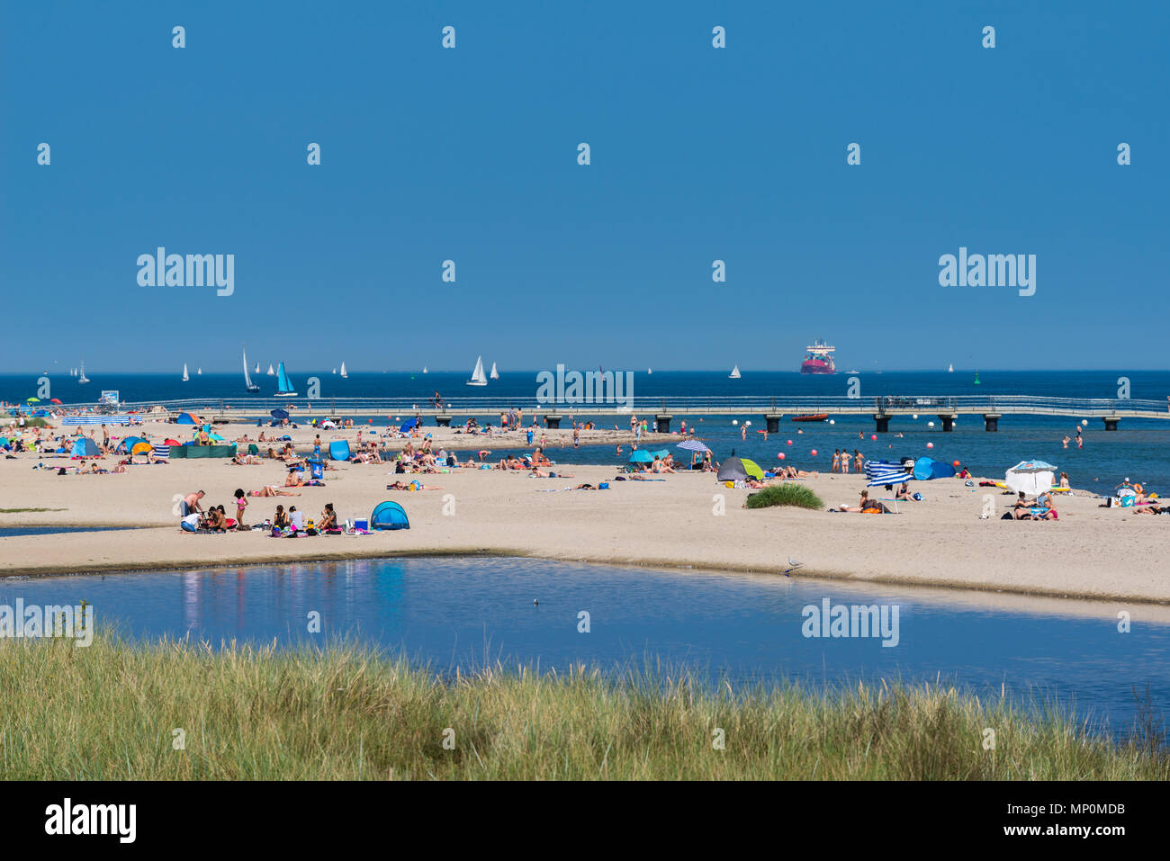 Relaxing on a hot summer day at the beach "Falkensteiner Strand", Kiel ...