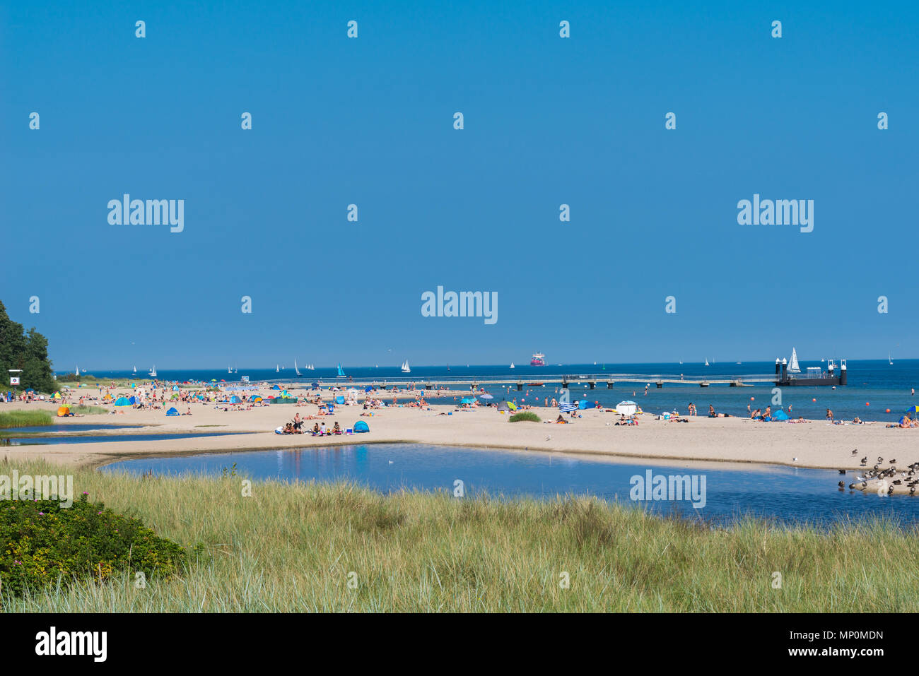 Relaxing on a hot summer day at the beach "Falkensteiner Strand", Kiel ...