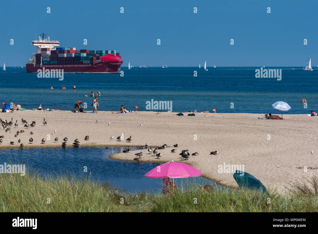 Relaxing at a hot summer day at the beach "Falkensteiner Strand", a ...