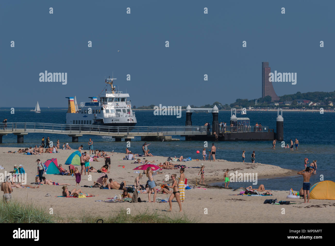 Relaxing at a hot summer day at the beach "Falkensteiner Strand", the ...