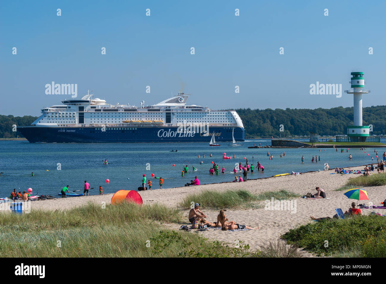 Relaxing on a hot summer day at the beach "Falkensteiner Strand", the ...