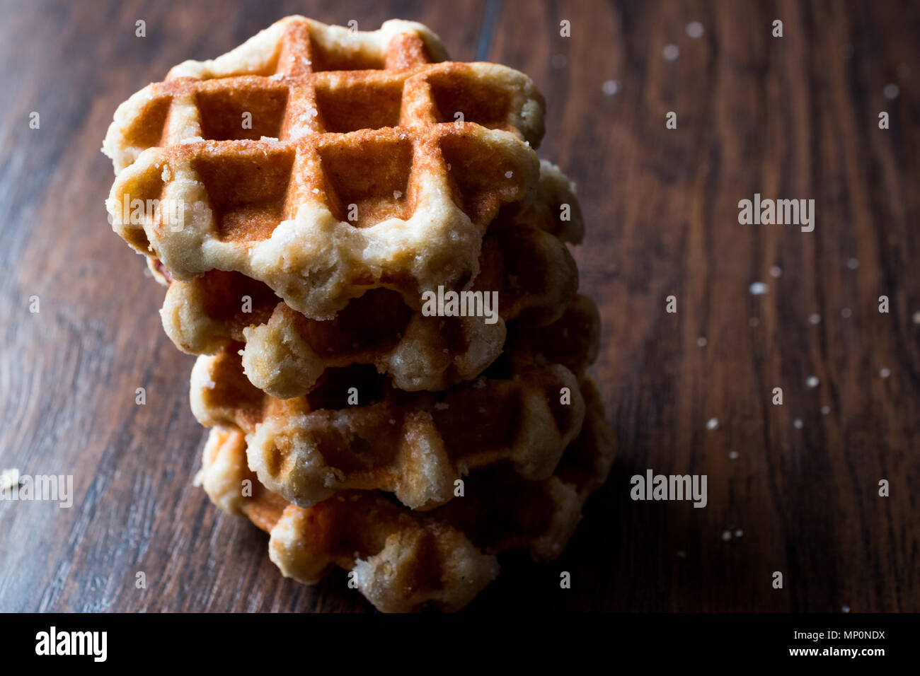 Stack of Plain Belgium Waffle on wooden surface. Traditional Food Stock ...