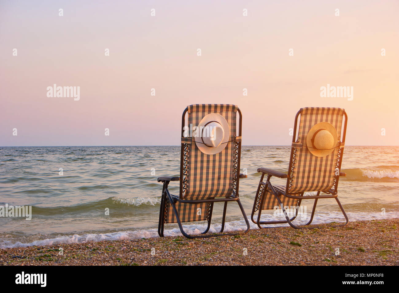 Checkered beach chairs on the seashore Stock Photo - Alamy