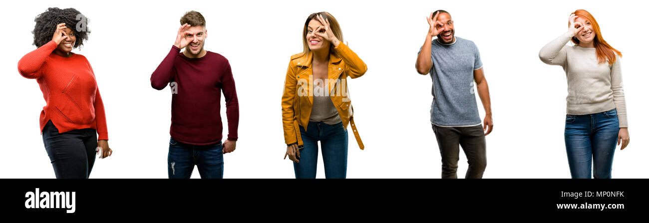 Group of cool people, woman and man looking at camera through fingers ...