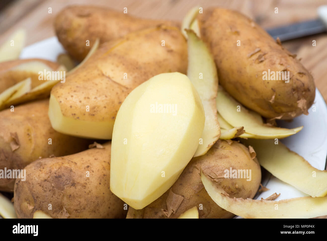 Peeled potato hi-res stock photography and images - Alamy
