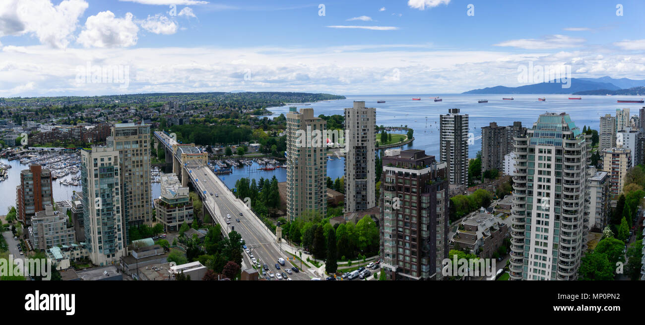 Aerial panoramic view of a beautiful modern cityscape during a cloudy ...
