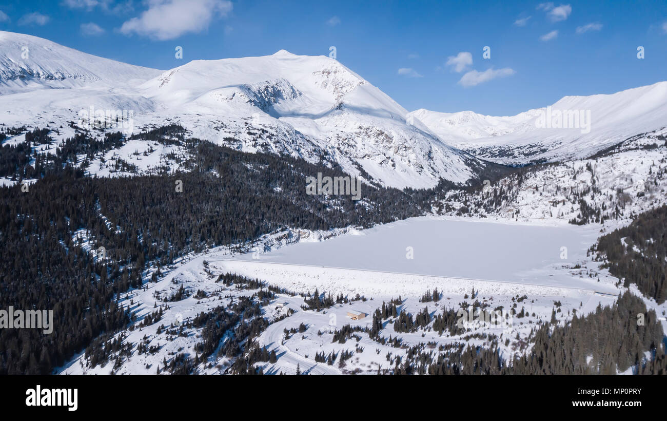 Aerial view of frozen Montgomery Reservoir, Pike National Forest ...