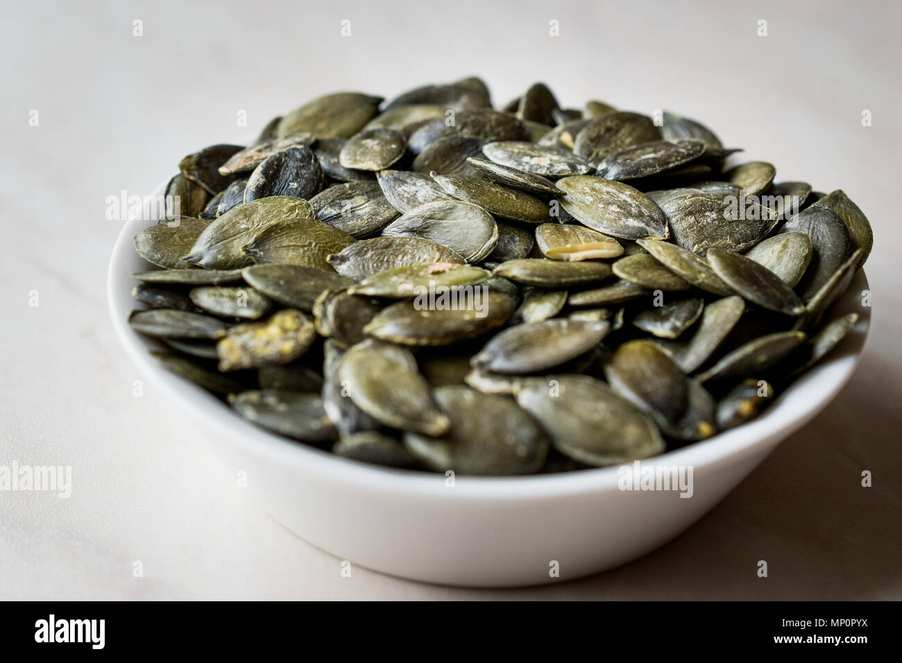 Raw Pumpkin Seeds Kernel in a bowl. Organic Food Stock Photo - Alamy