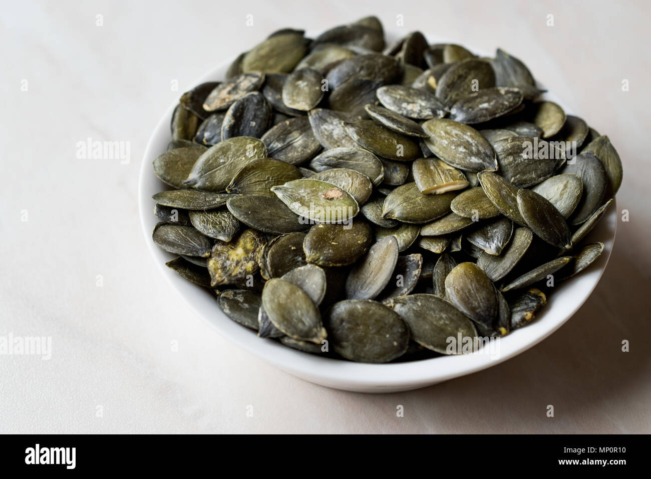Raw Pumpkin Seeds Kernel in a bowl. Organic Food Stock Photo - Alamy