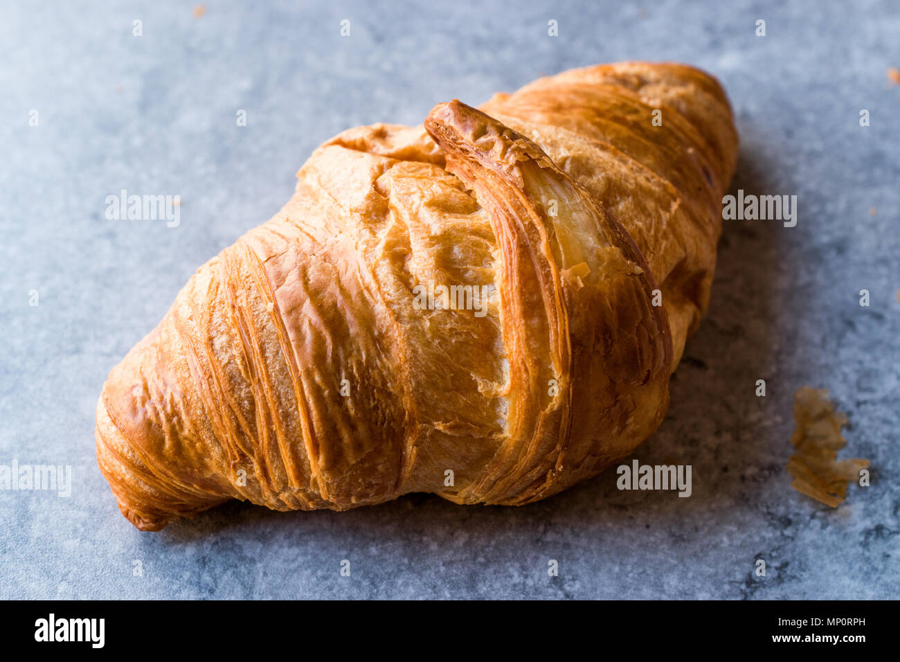Freshly Baked Croissant on Blue Surface. Bakery Concept Stock Photo - Alamy