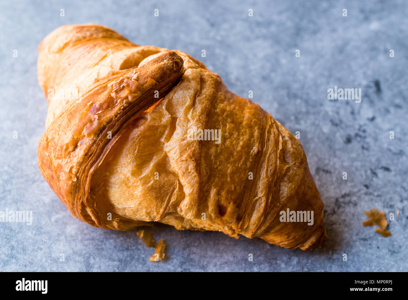 Freshly Baked Croissant on Blue Surface. Bakery Concept Stock Photo - Alamy