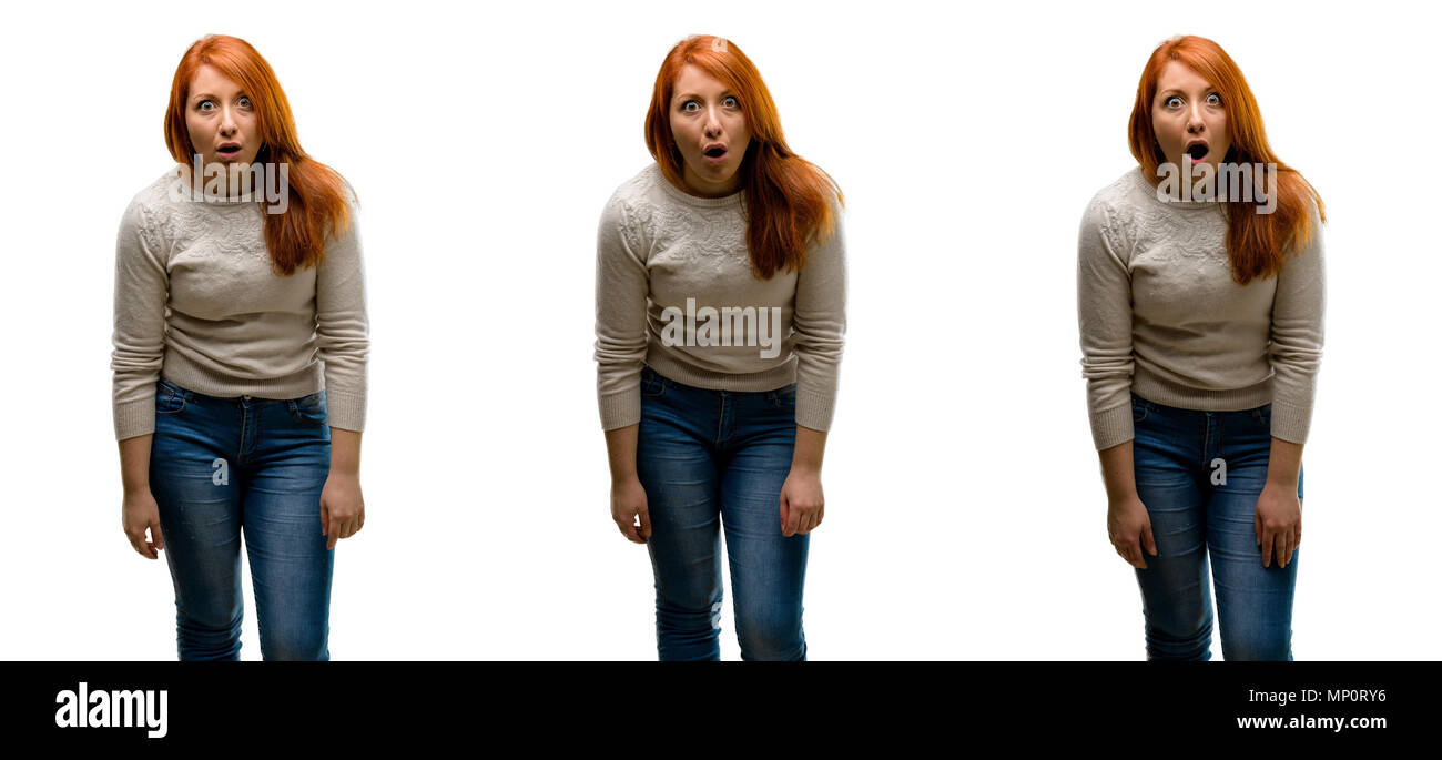 Young Beautiful redhead woman scared in shock, expressing panic and ...