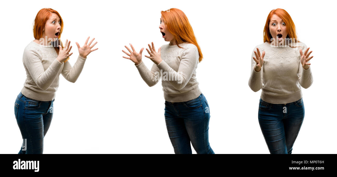Young Beautiful redhead woman stressful keeping hands on head ...