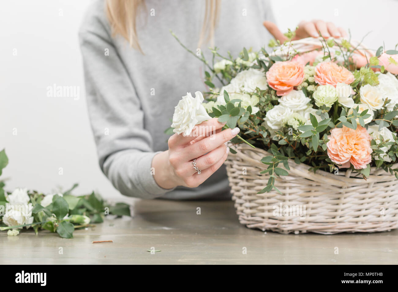 close-up hands female florist. Floral workshop - woman making a ...