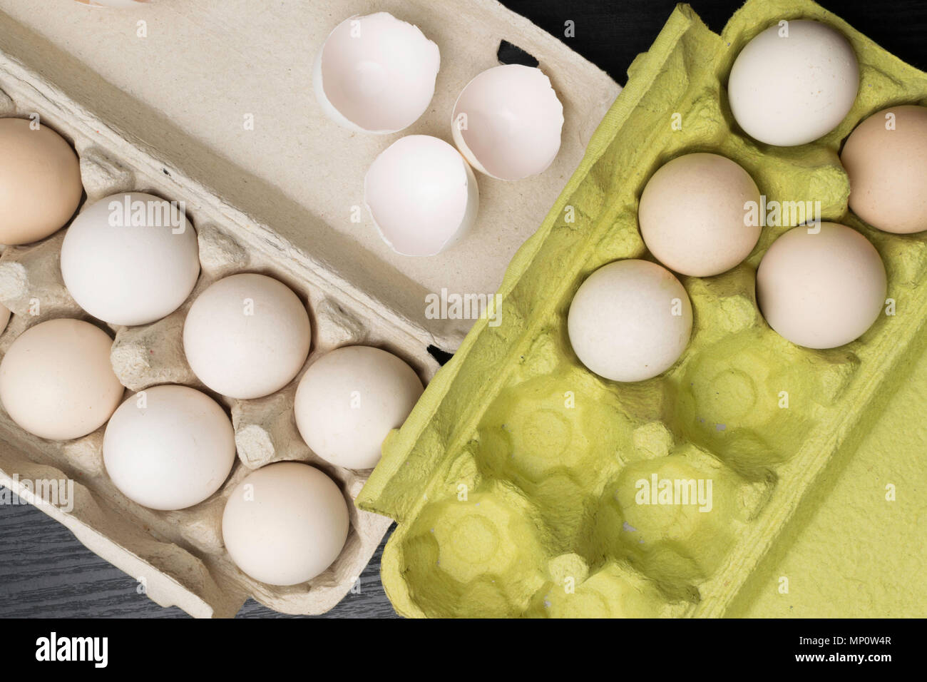 Fresh rustic eggs in egg rack put on wood table prepare for cooking in ...