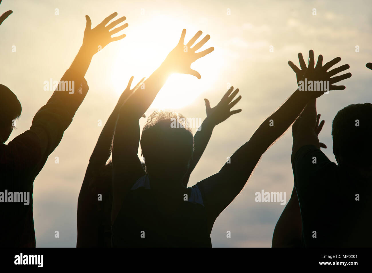 Hands against sun background Stock Photo - Alamy
