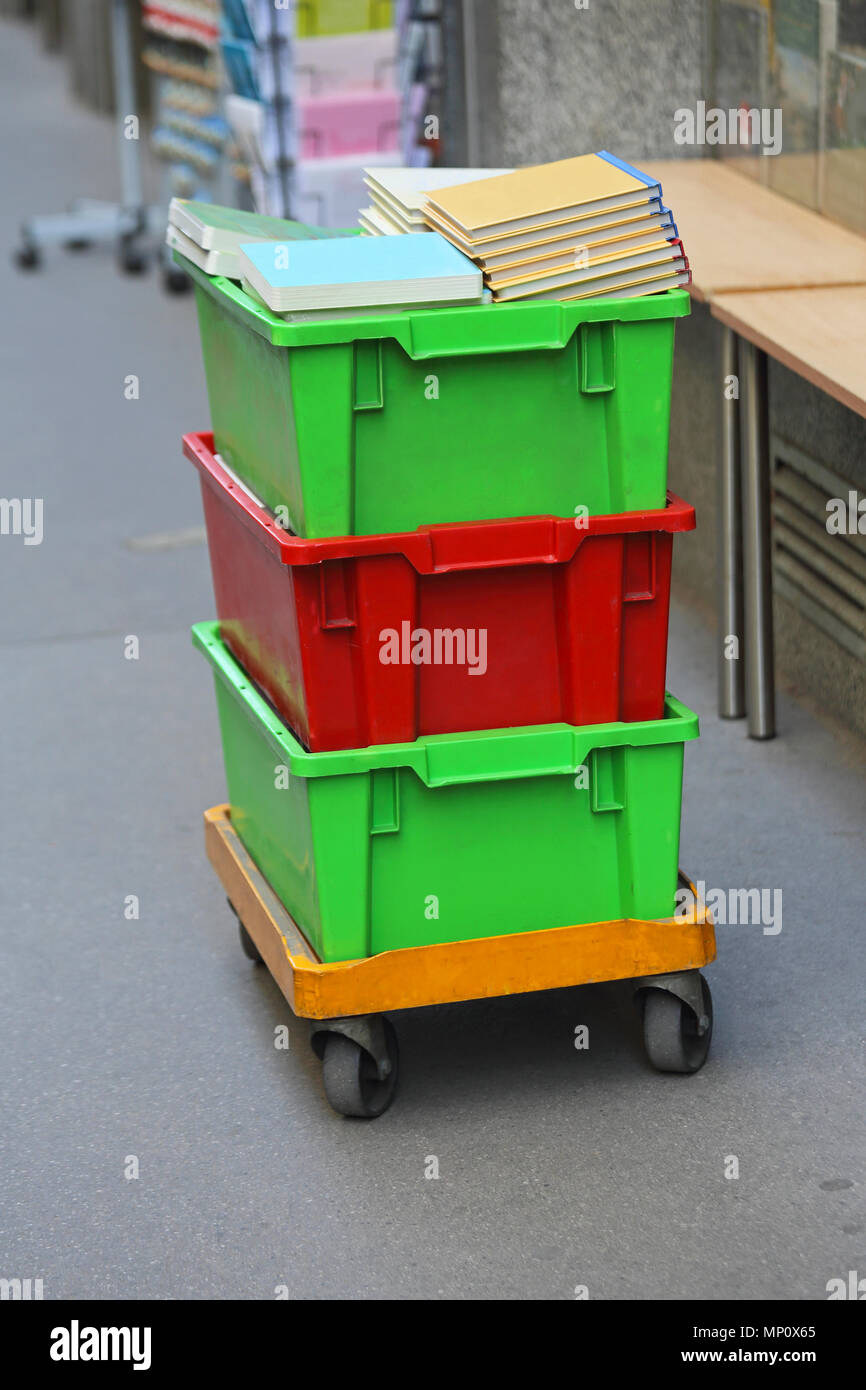 Moving Books in Plastic Crates With Cart at Street Stock Photo - Alamy