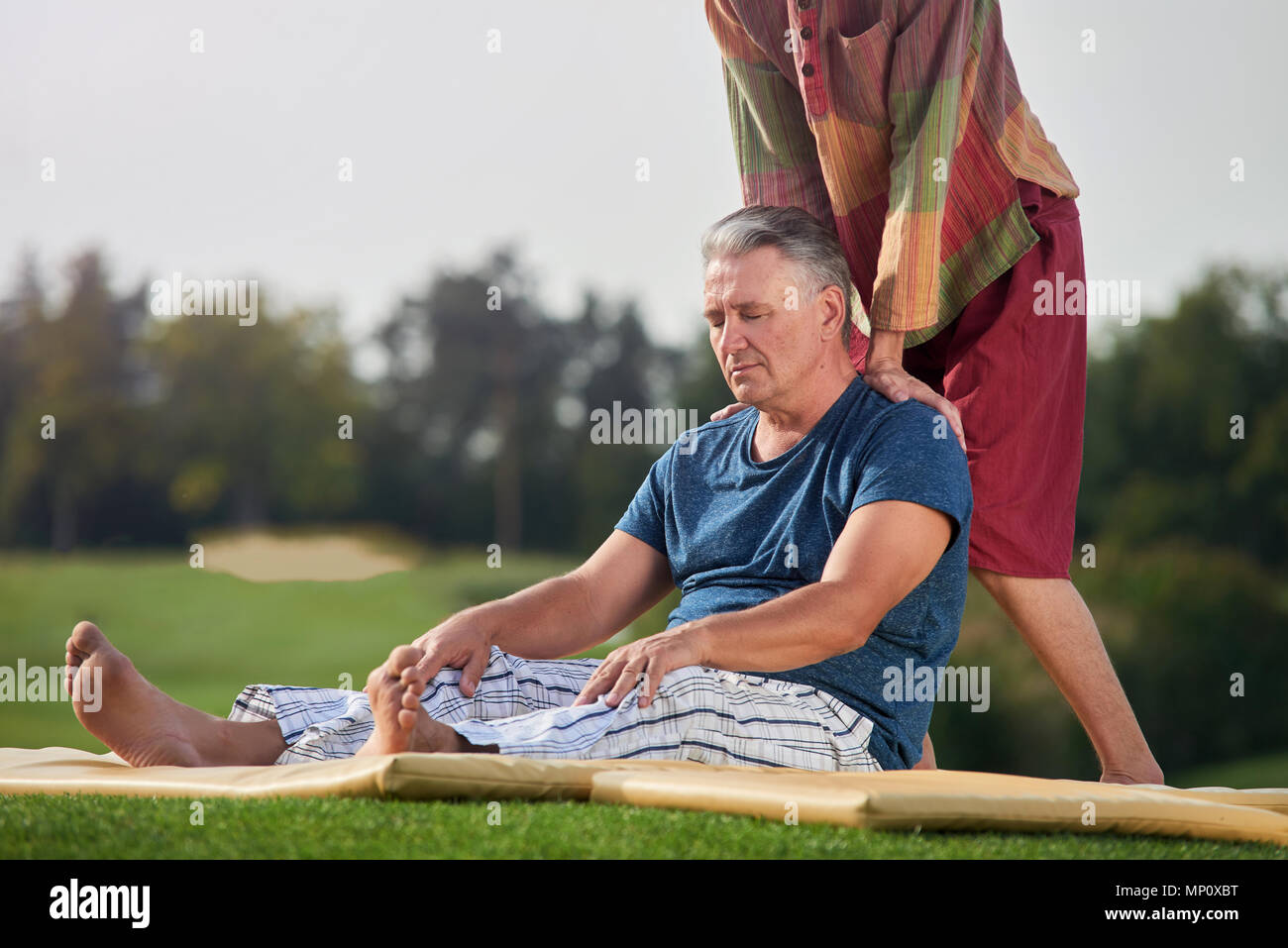 Man sitting on a mat hi-res stock photography and images - Alamy