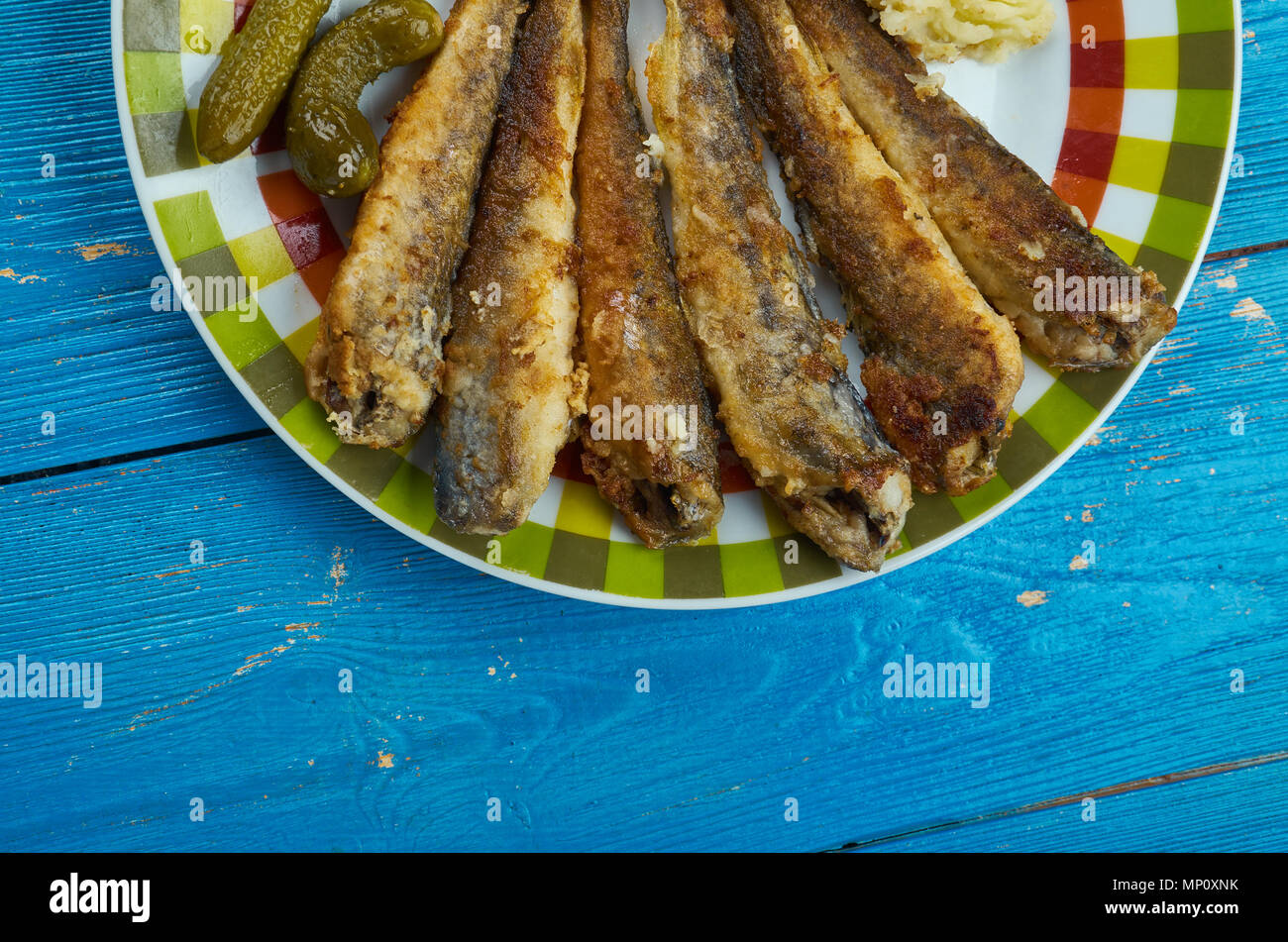 Fried navaga , Fried fish with vegetable garnish Stock Photo - Alamy
