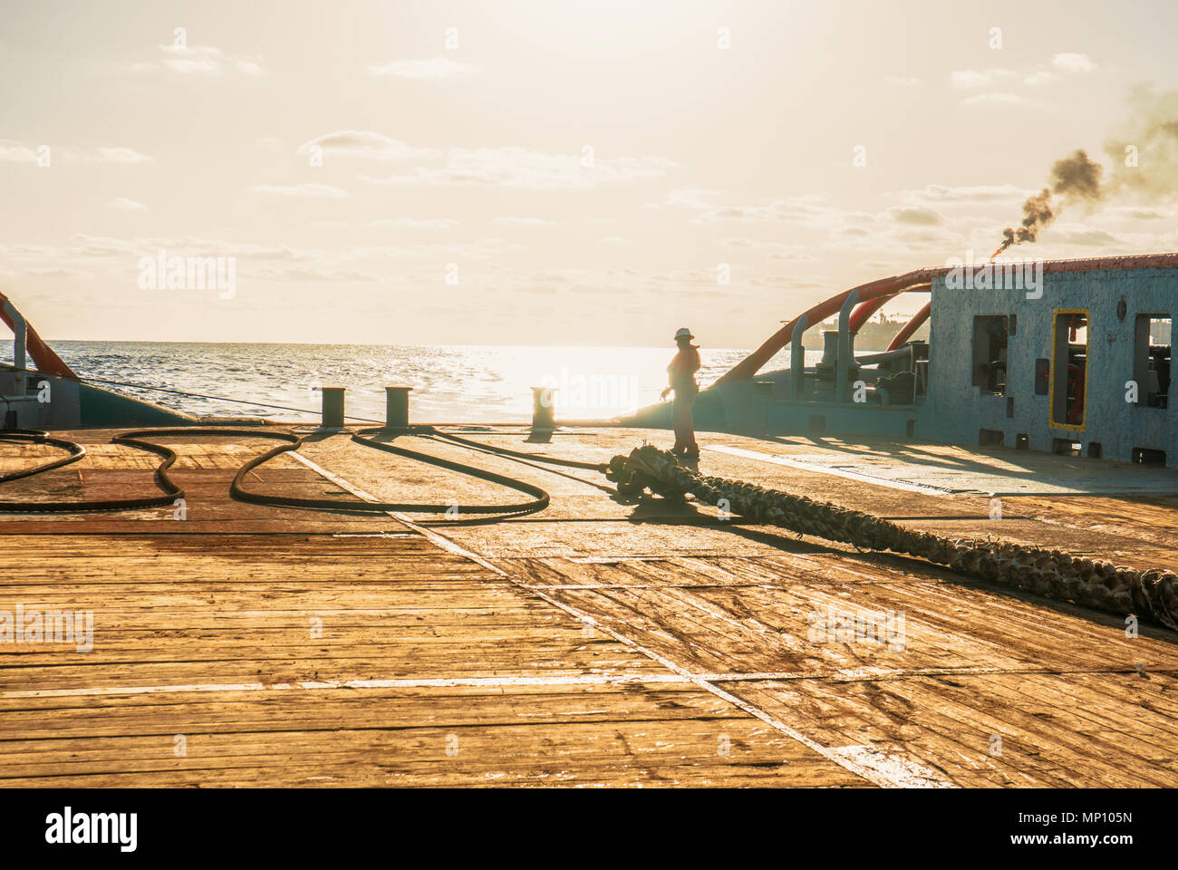 AHTS vessel crew prepare vessel towing wire for static tow tanker ...