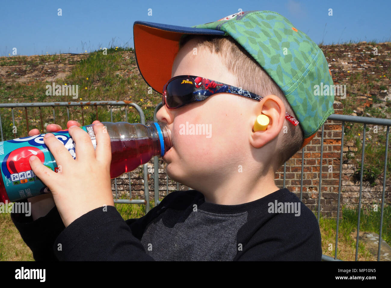 Young boy drinking juice in warm weather Stock Photo - Alamy
