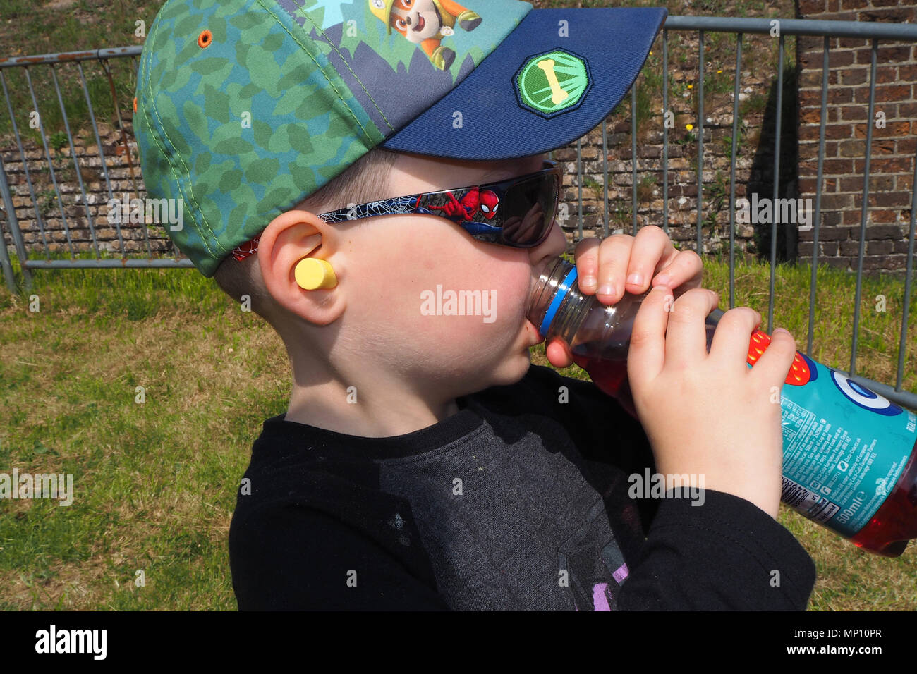 Young boy drinking juice in warm weather Stock Photo - Alamy