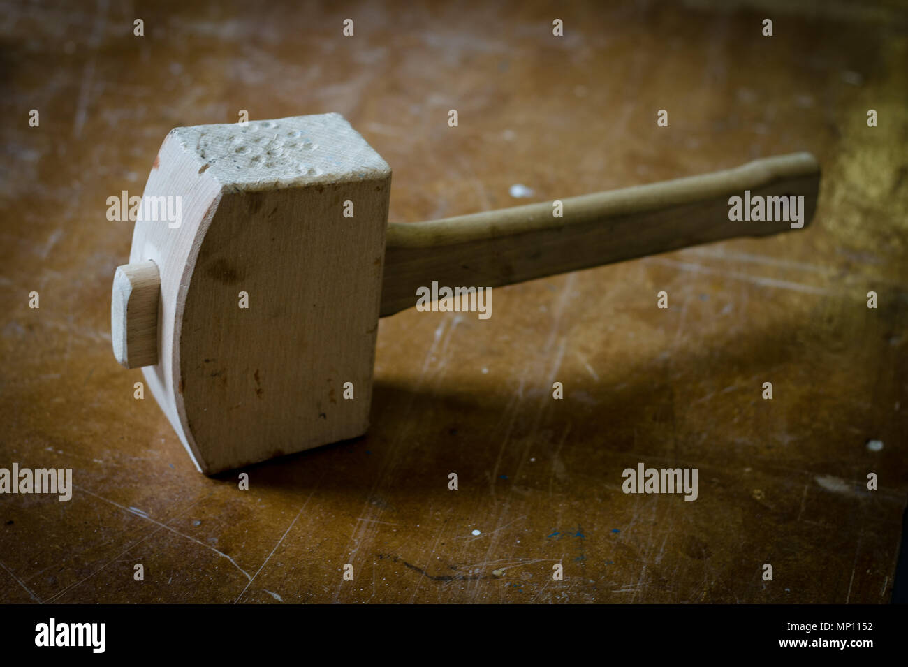 A close up of a wooden mallet on the workshop table Stock Photo - Alamy
