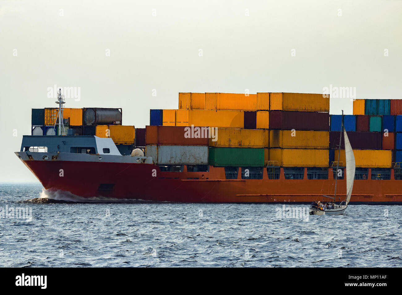 Red container ship. Logistics and production transfer Stock Photo - Alamy