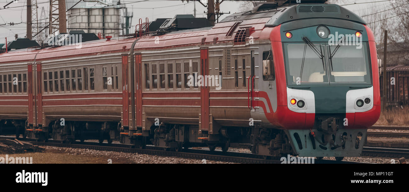 Red diesel passenger train driving at the old terminal Stock Photo - Alamy