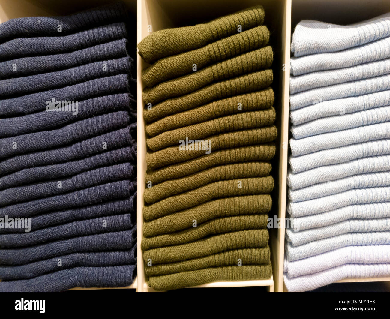 colorful socks stack on shelves for sale in clothing store Stock Photo ...