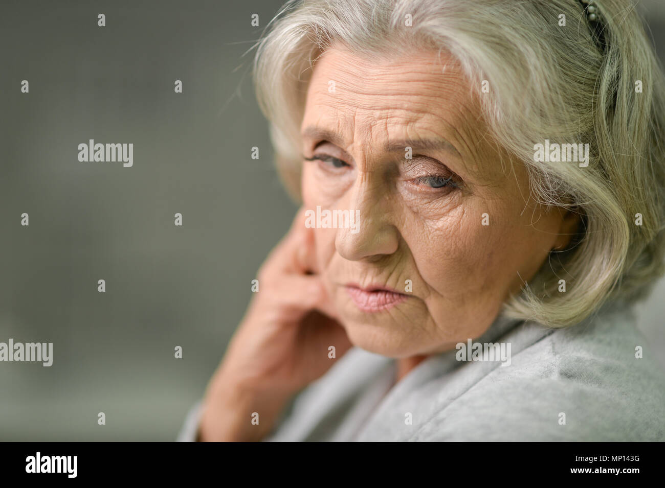Portrait of tired senior woman Stock Photo - Alamy